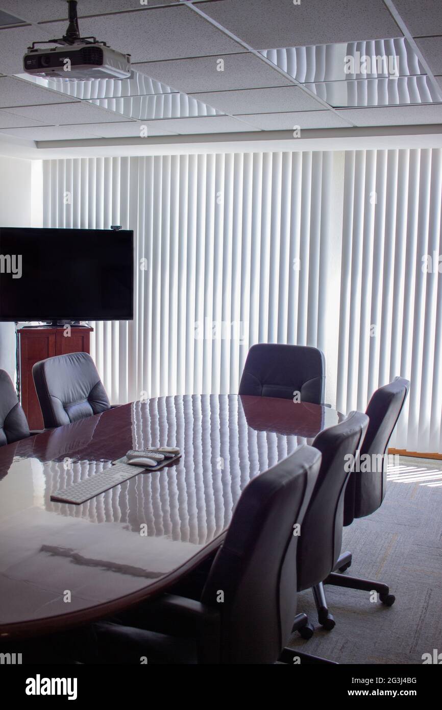 Inside view of a modern executive conference room with a glass table ...