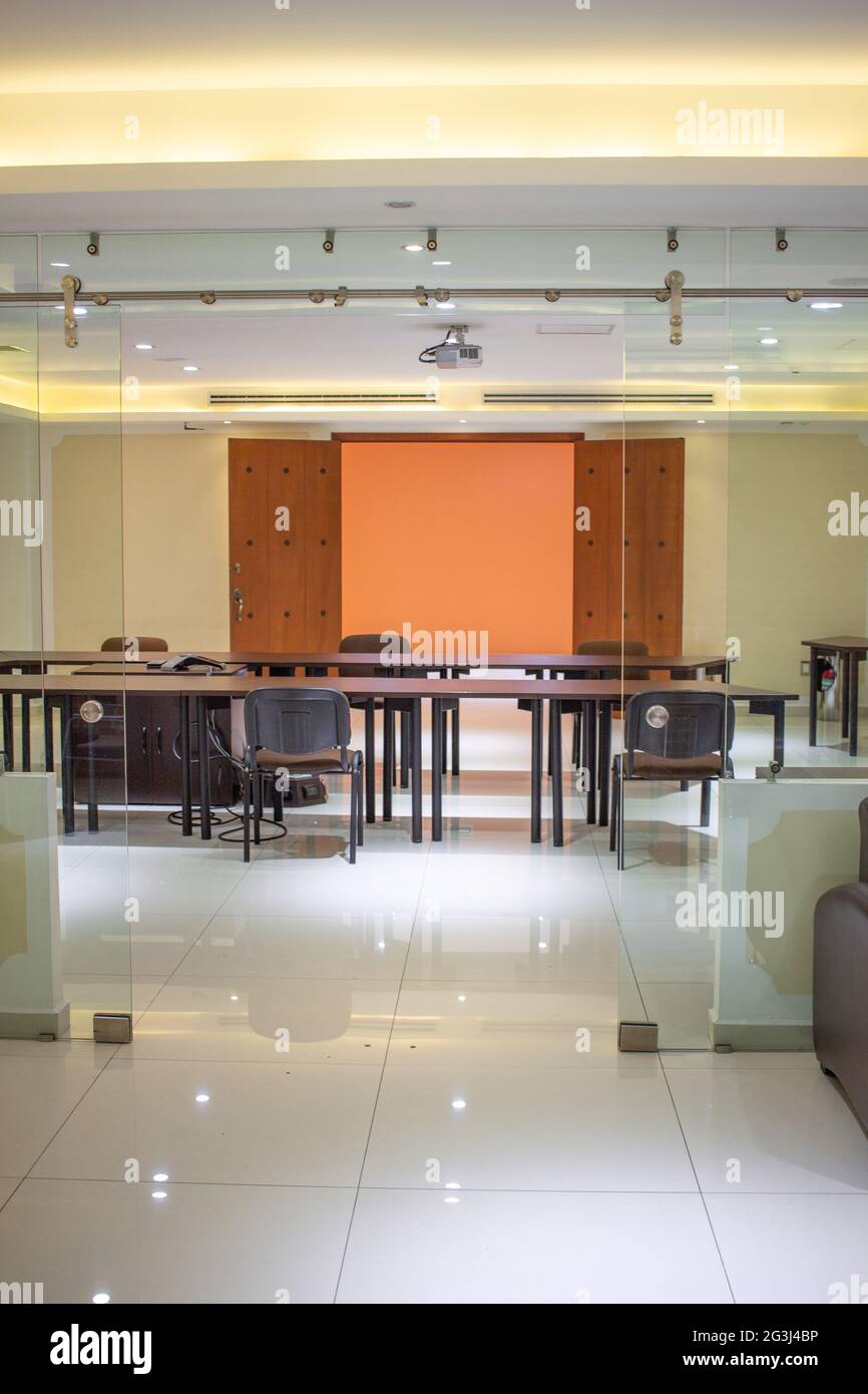 Inside view of a modern conference room with empty poster, chairs, and ...