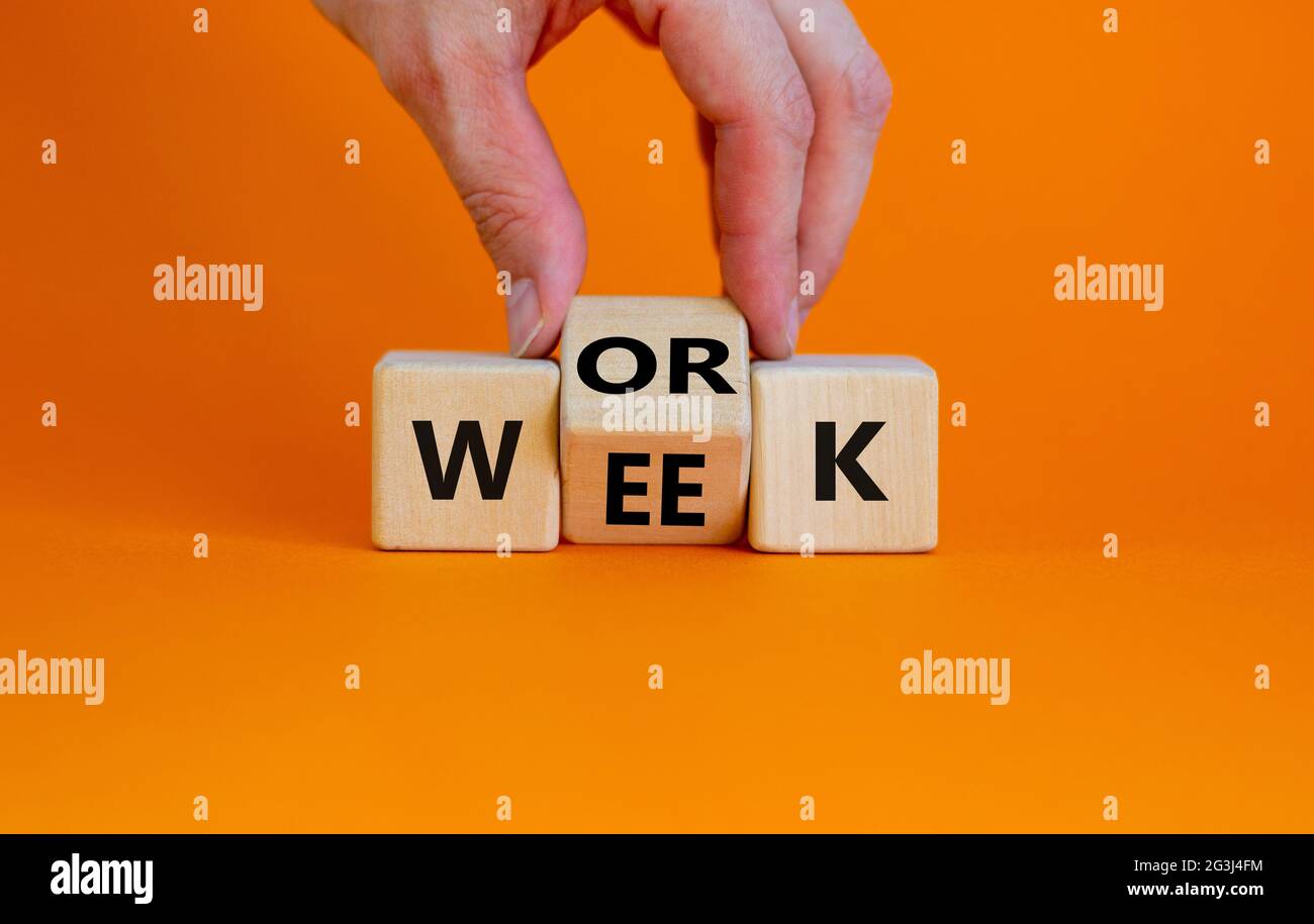 Work week symbol. Businessman turns the wooden cube with words 'Work ...