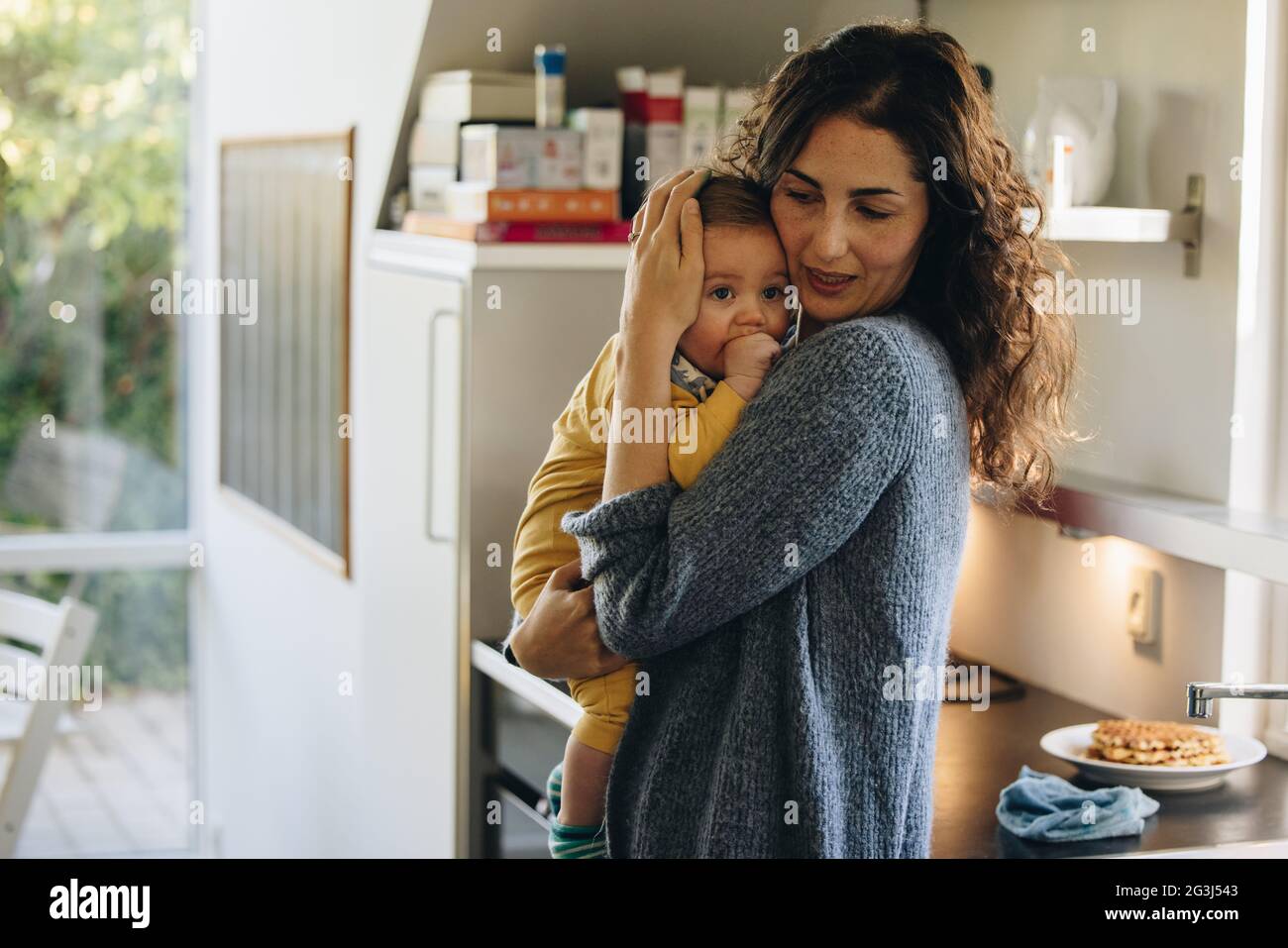 Baby comforting holding hi-res stock photography and images - Alamy