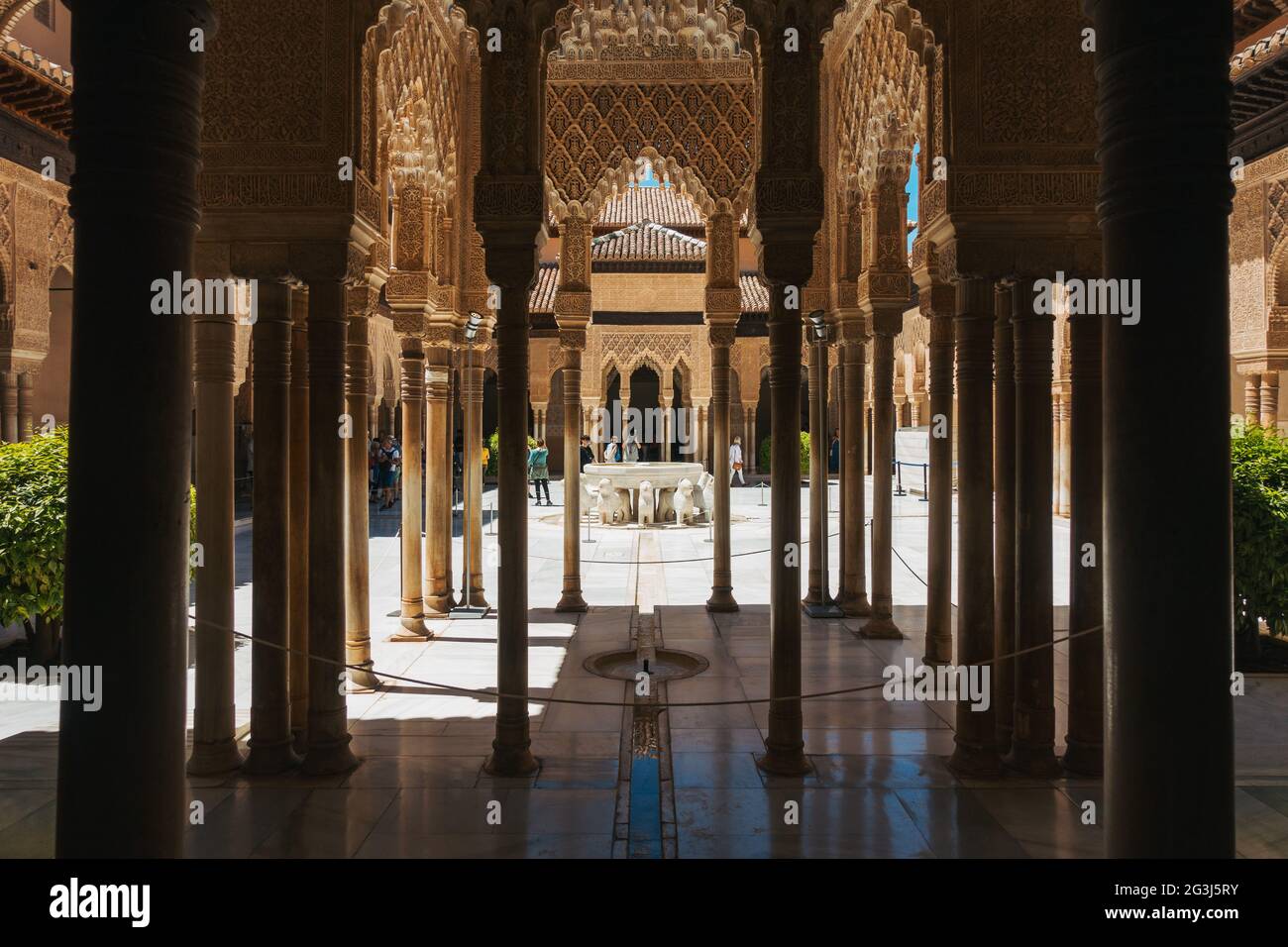 Pillars line the entrance to the Patio de los Leones (Patio of the ...