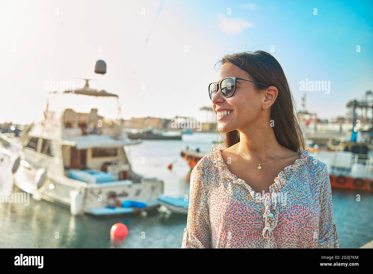 Beautiful young woman in luxury yacht bay, ready to sail. Summer ...
