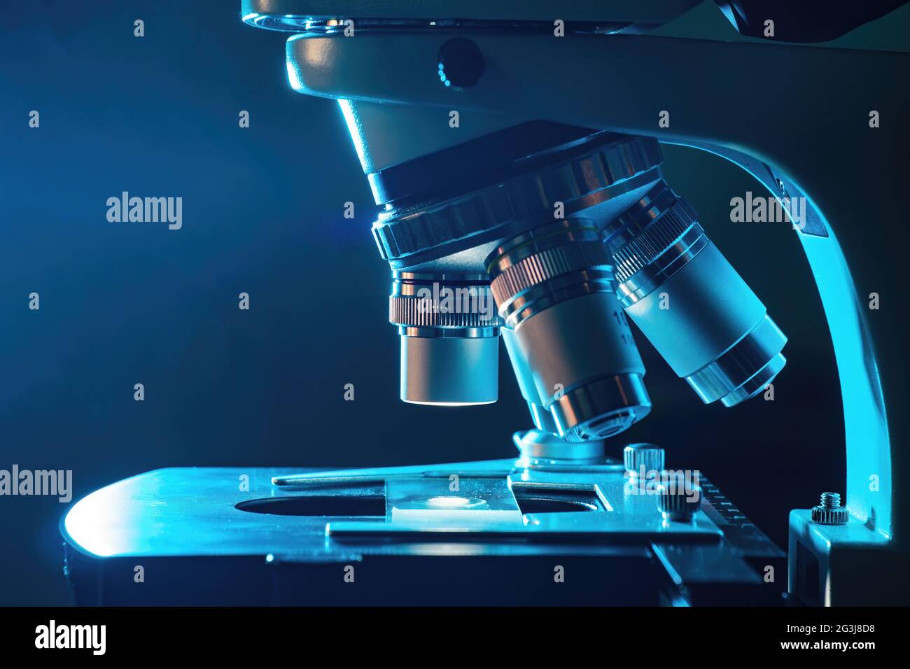 Microscope in laboratory at night. Microbiology and research concept ...