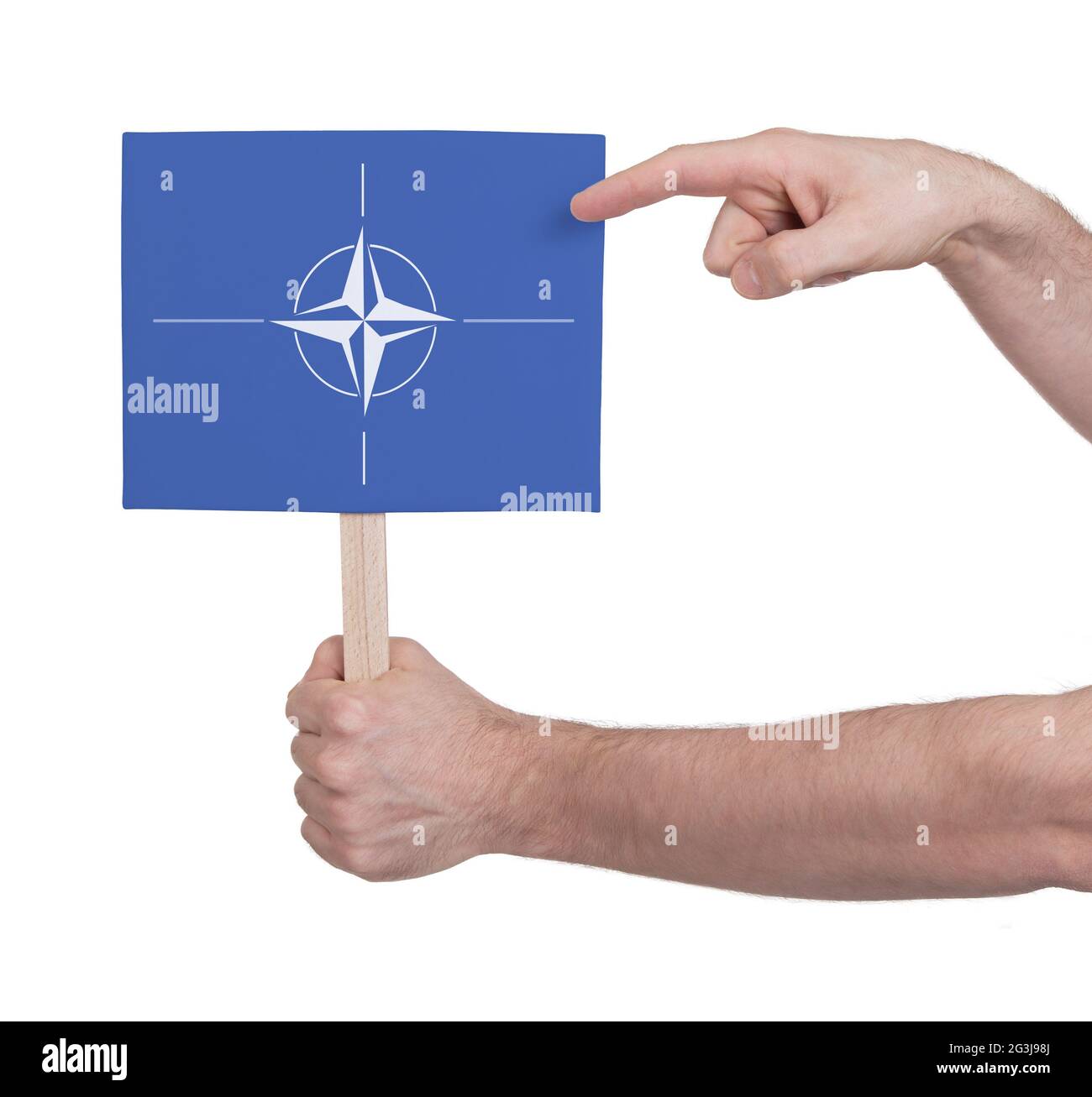 Hand holding small card - Flag of NATO Stock Photo - Alamy