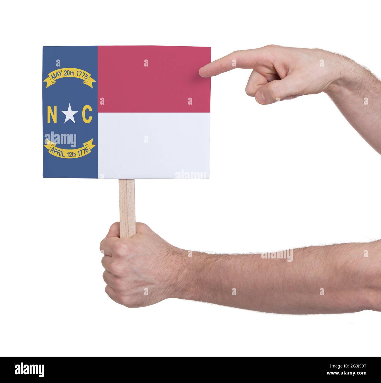 Hand holding small card - Flag of North Carolina Stock Photo - Alamy