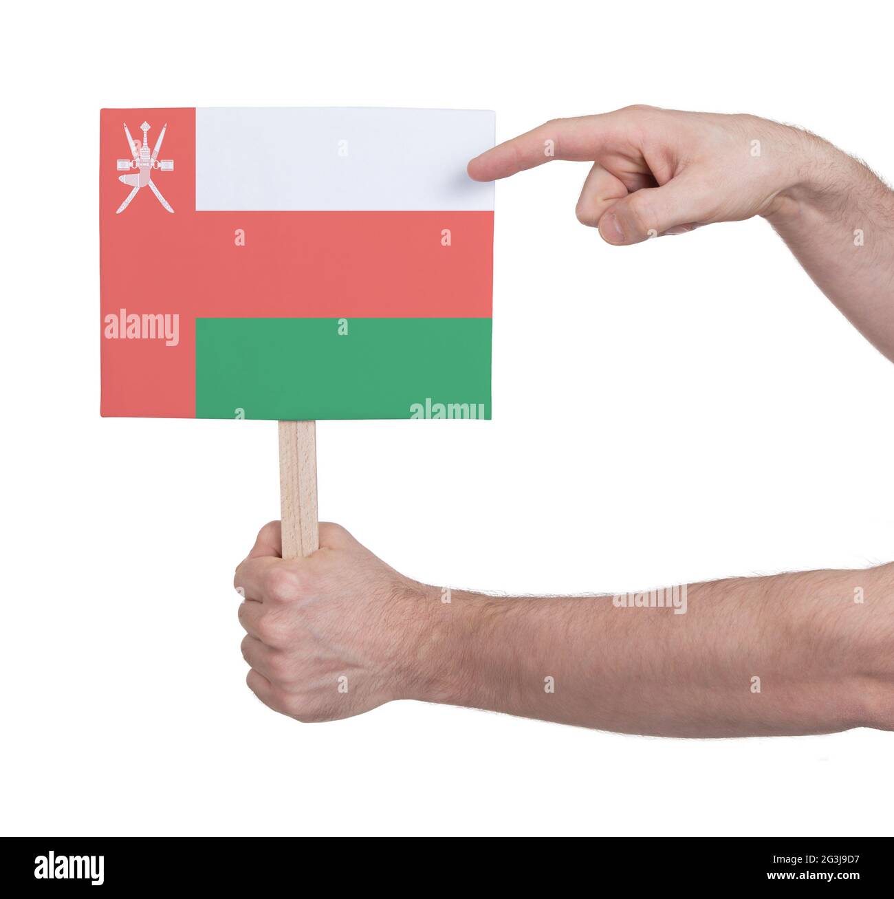 Hand holding small card - Flag of Oman Stock Photo - Alamy