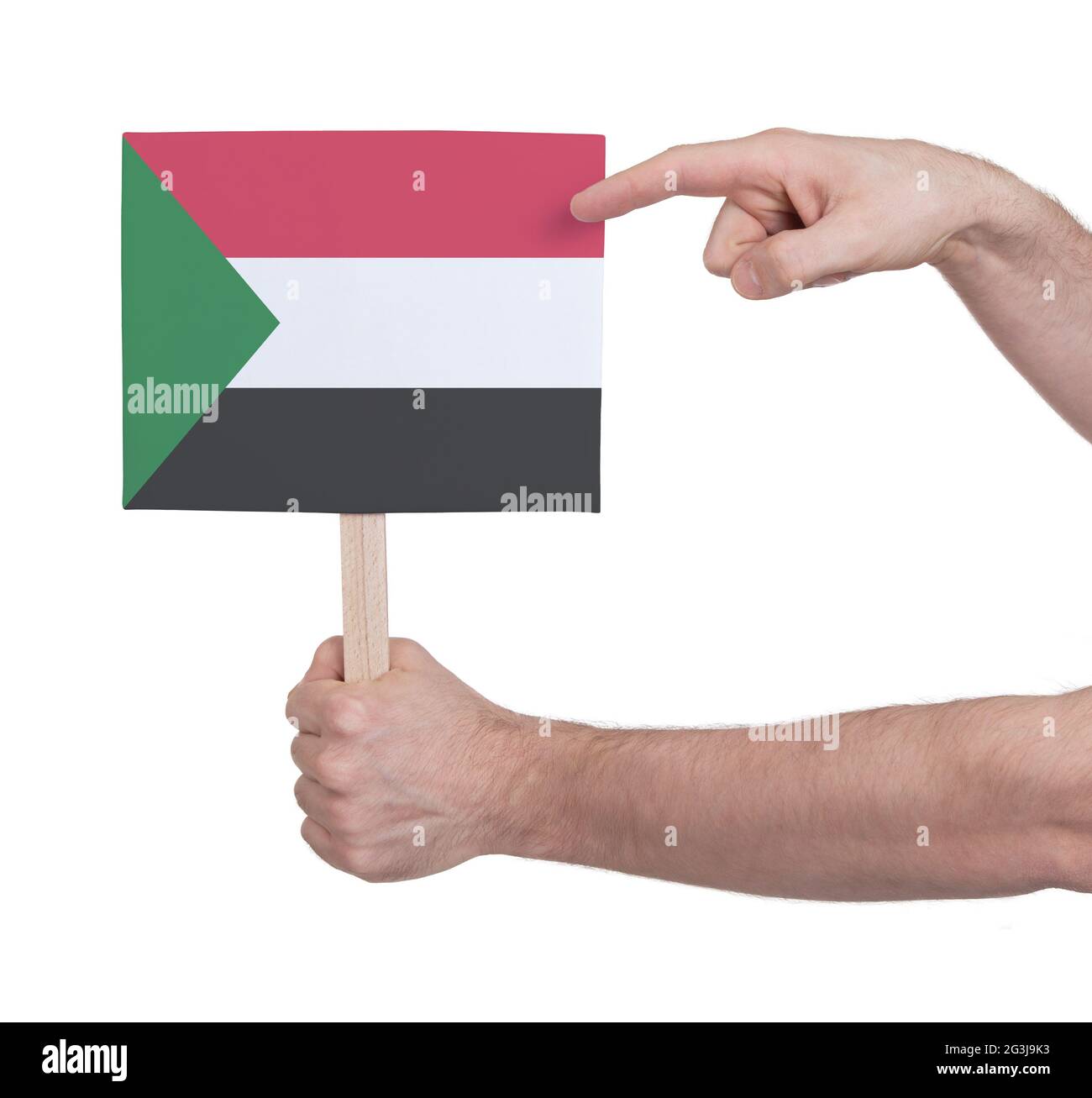 Hand holding small card - Flag of Sudan Stock Photo - Alamy