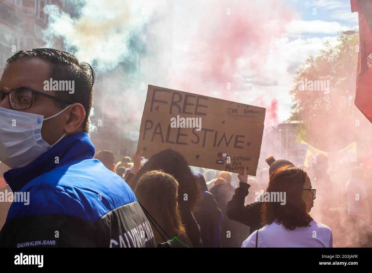 LONDON, ENGLAND- 15 May 2021: Protesters amid smoke flare fog at a ...