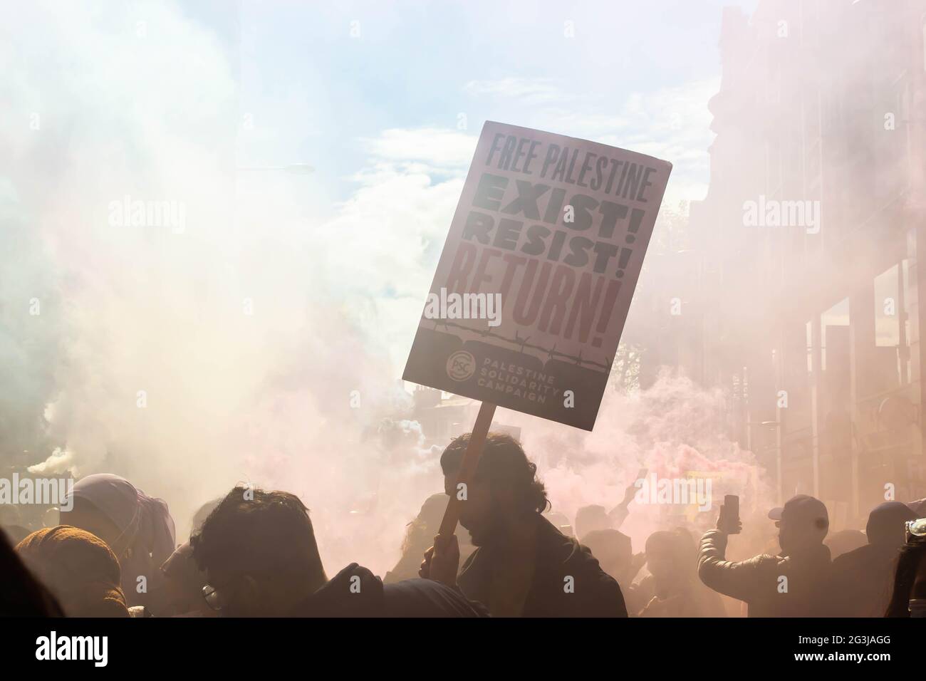 LONDON, ENGLAND- 15 May 2021: Protesters amid smoke flare fog at a ...