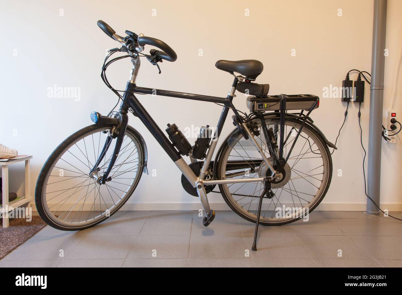 Electric bicycle in a garage Stock Photo - Alamy