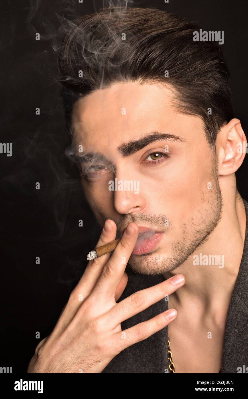 Fashion model smoking cigar hi-res stock photography and images - Alamy