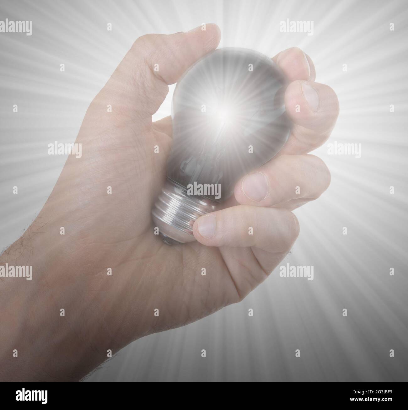Hand holding an light bulb Stock Photo - Alamy