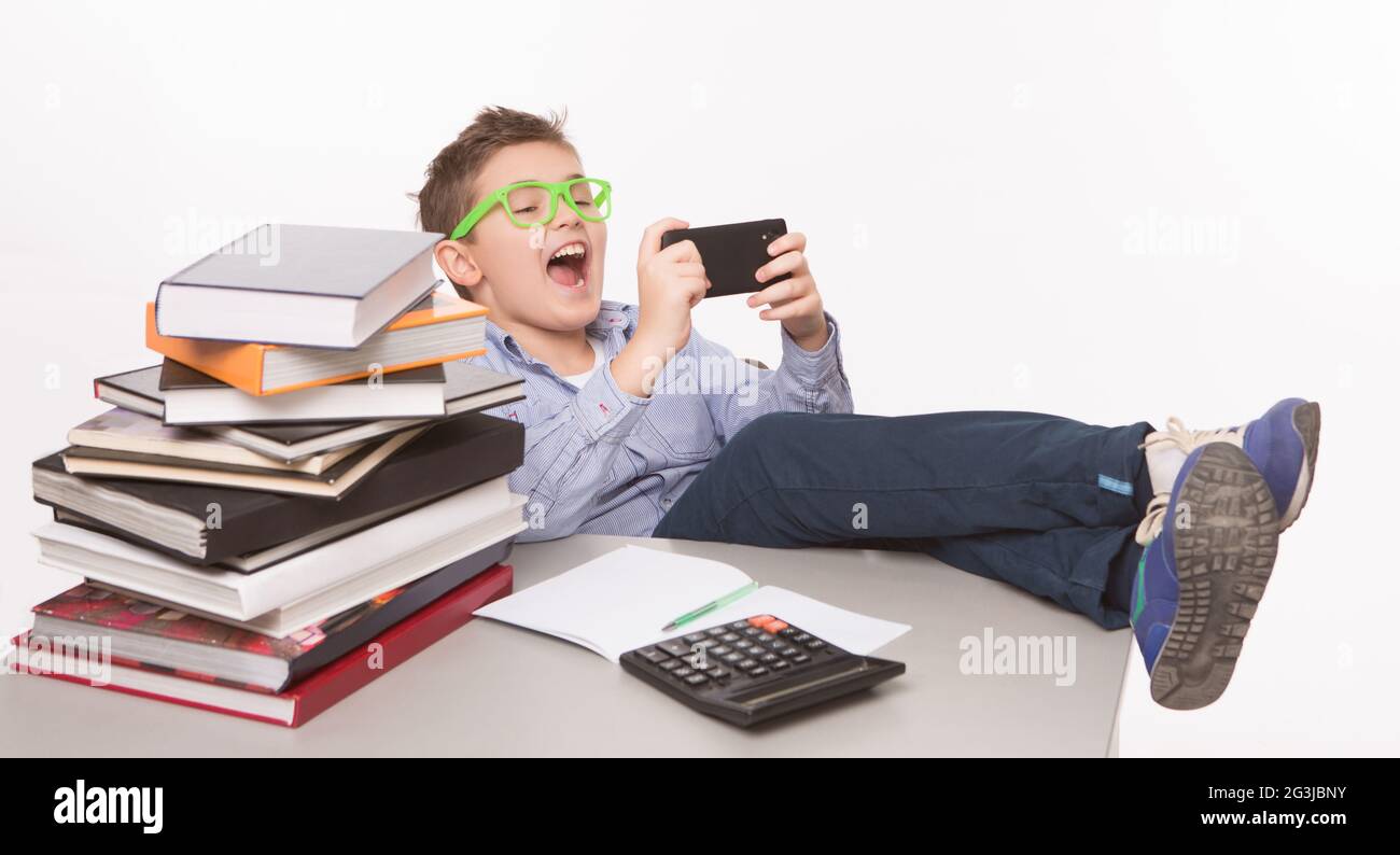 Little boy playing with his mobile phone Stock Photo - Alamy
