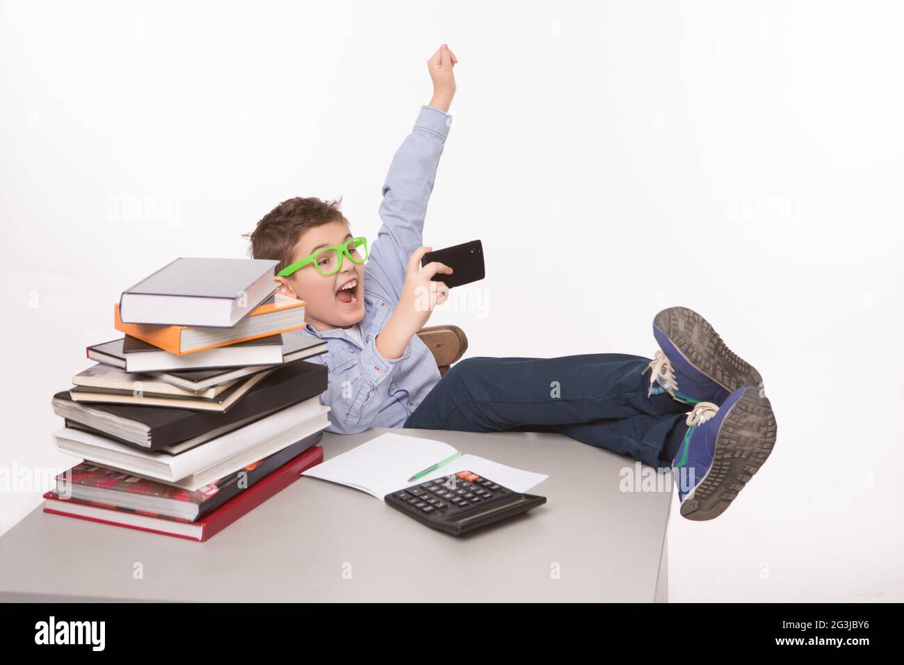 Little boy playing with his mobile phone Stock Photo - Alamy