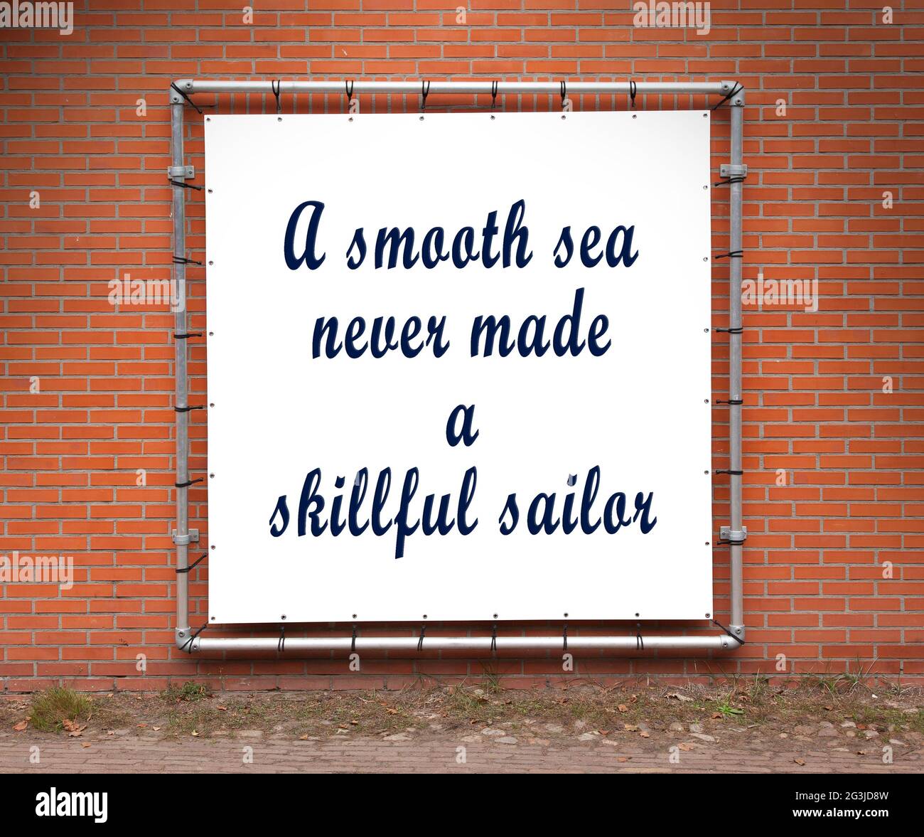Large banner with inspirational quote on a brick wall Stock Photo - Alamy