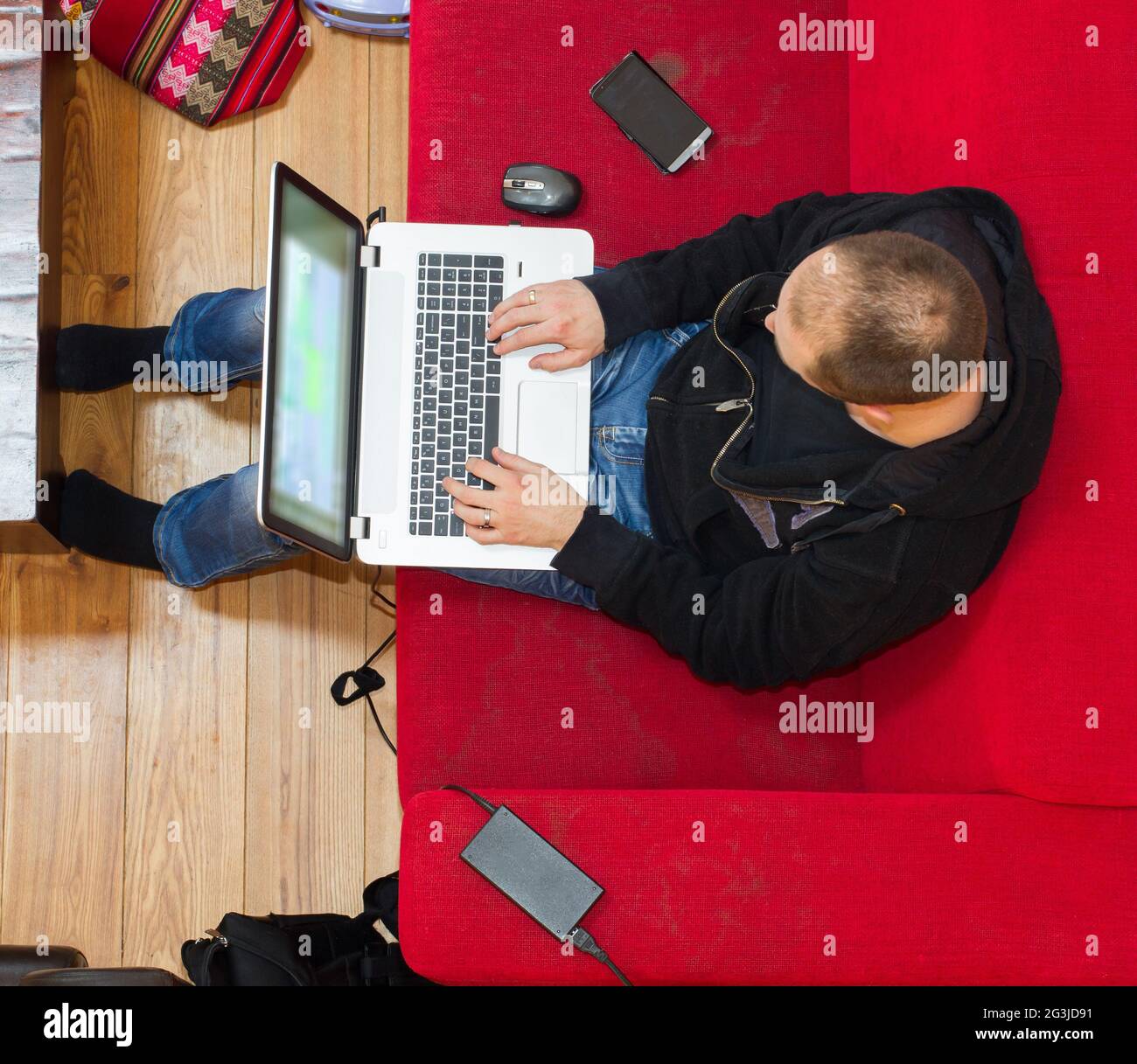 High angle view of a man using his laptop Stock Photo - Alamy