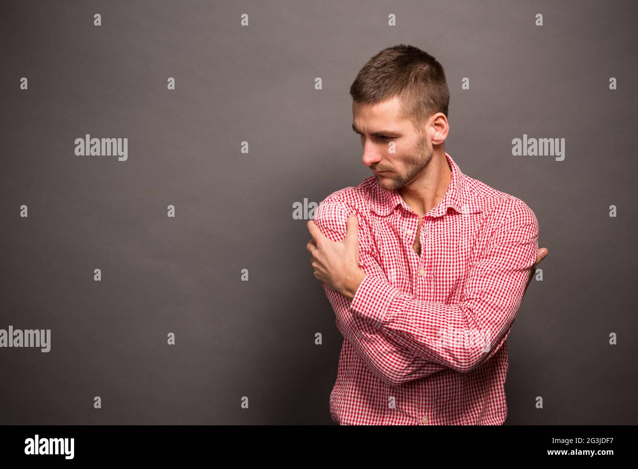 Man hugging himself hi-res stock photography and images - Alamy