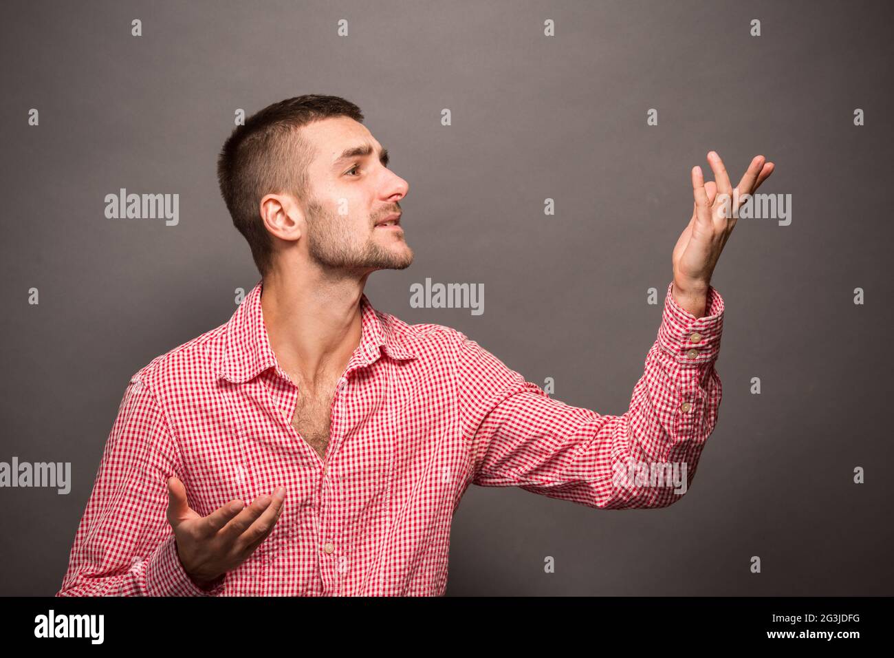 Man explaining something in studio Stock Photo - Alamy