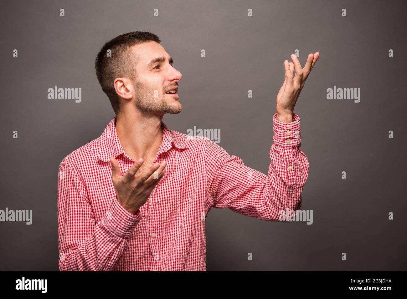 Man explaining something in studio Stock Photo - Alamy