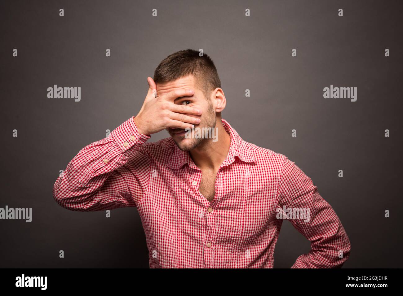 Man covering eyes his face Stock Photo - Alamy