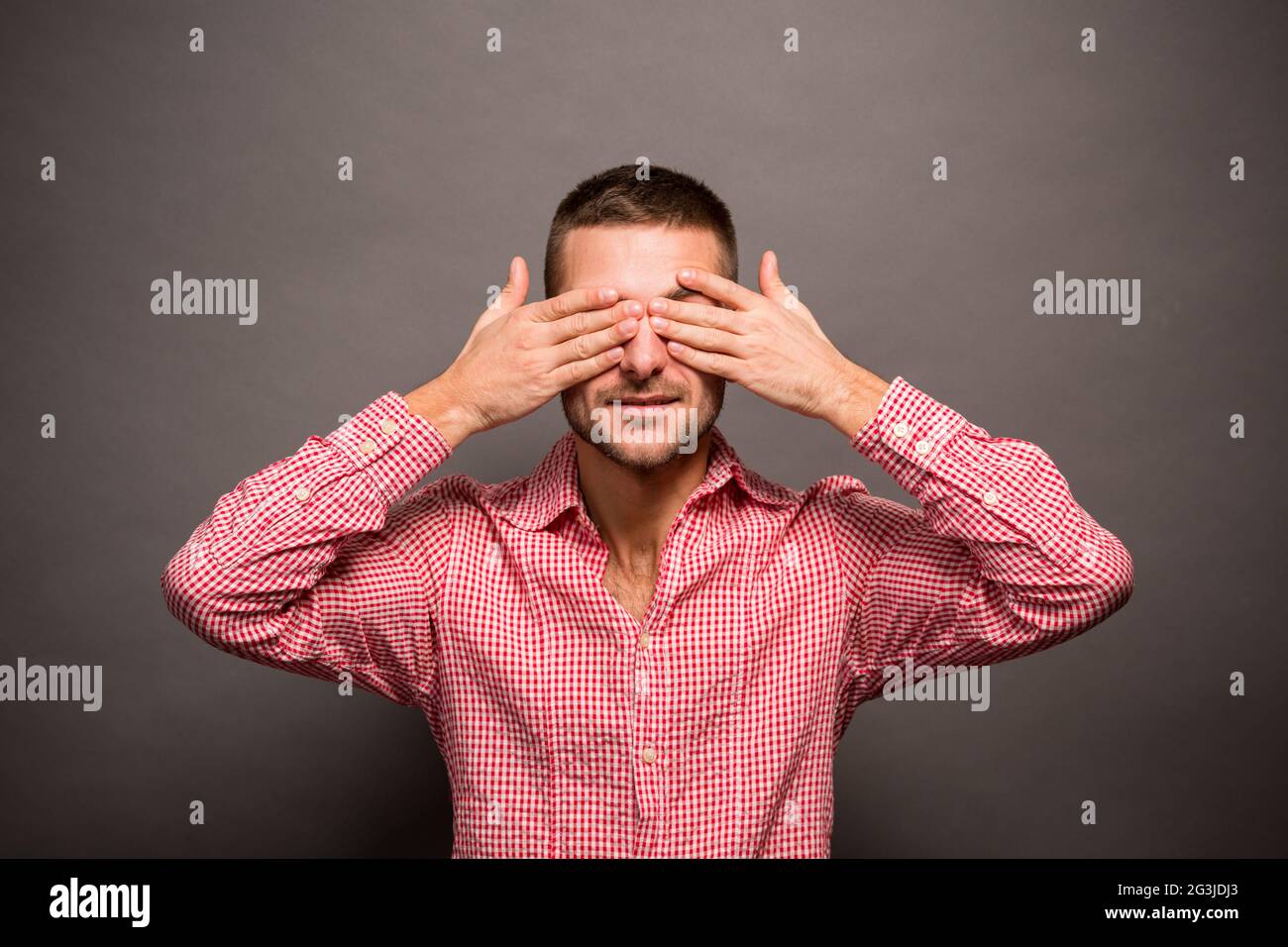 Young person covering eyes hands hi-res stock photography and images ...
