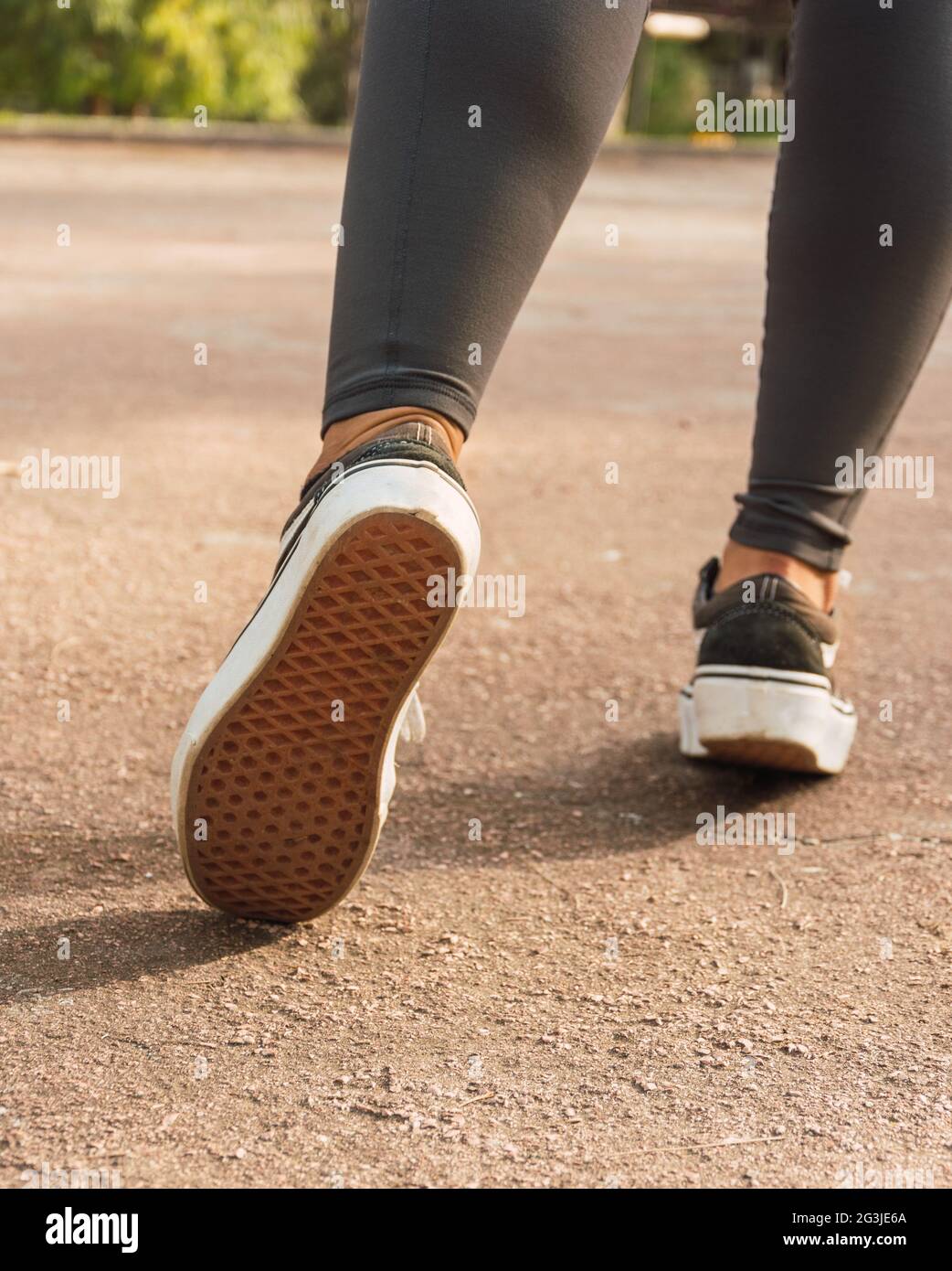 Sporty female's legs working out in a park Stock Photo - Alamy