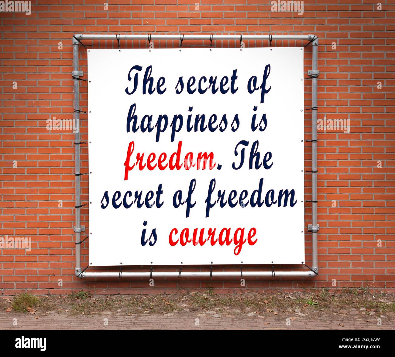Large banner with inspirational quote on a brick wall Stock Photo - Alamy