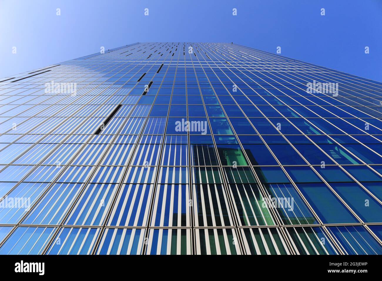 Exterior of a glass walled skyscraper Stock Photo - Alamy