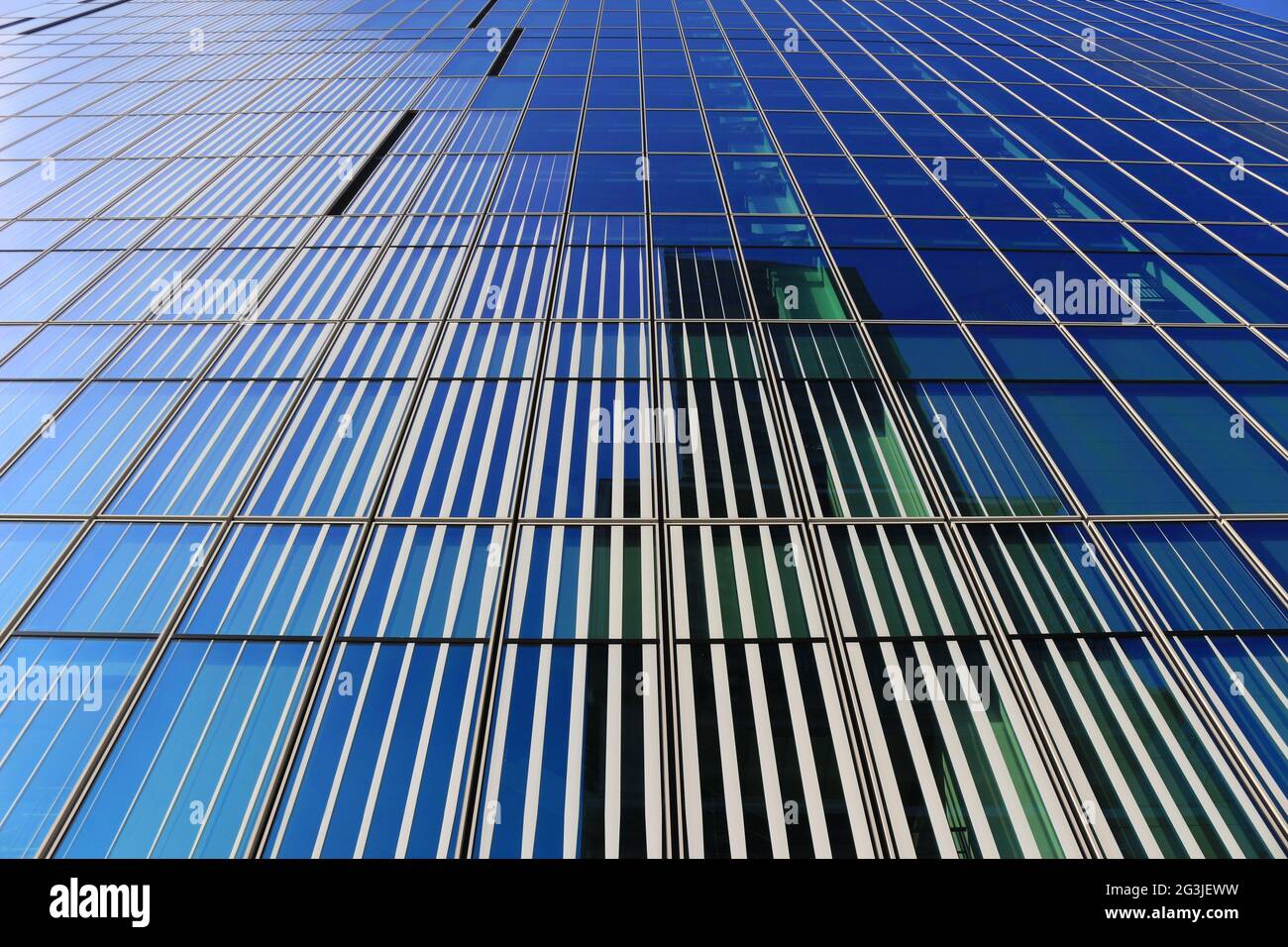 Exterior of a glass walled skyscraper Stock Photo - Alamy