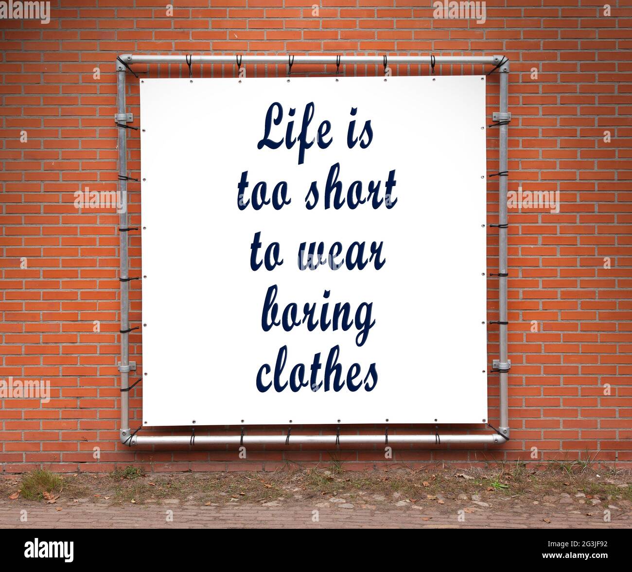 Large banner with inspirational quote on a brick wall Stock Photo - Alamy