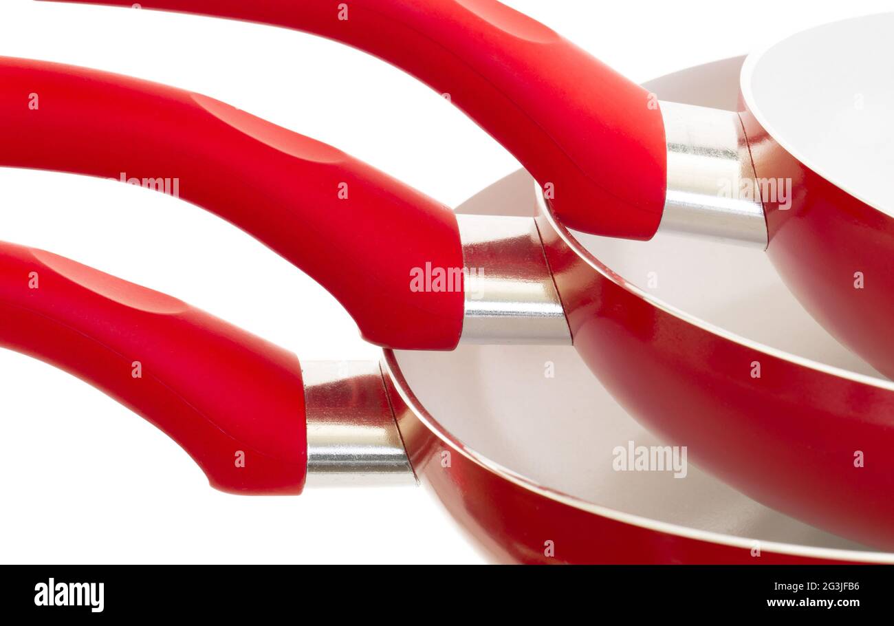 Set of three frying pans, red Stock Photo - Alamy