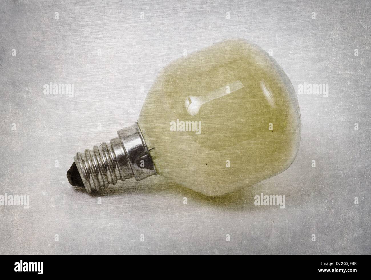 Old yellow lightbulb isolated on a white background Stock Photo - Alamy