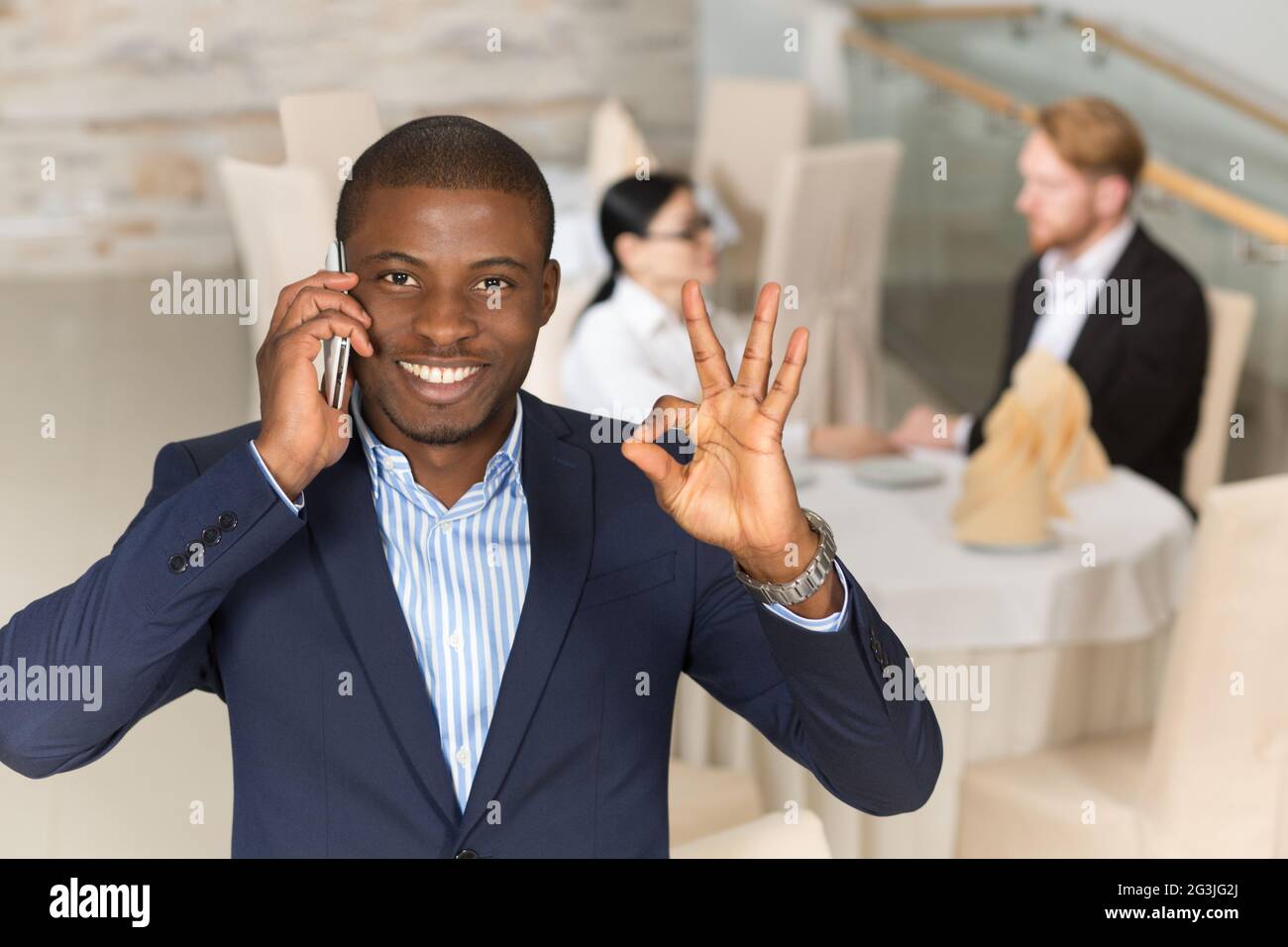 Businessman speaking over mobile hi-res stock photography and images ...