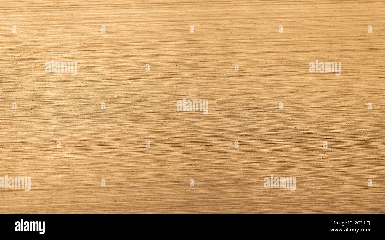 Gold color aluminium closeup view making a background Stock Photo - Alamy