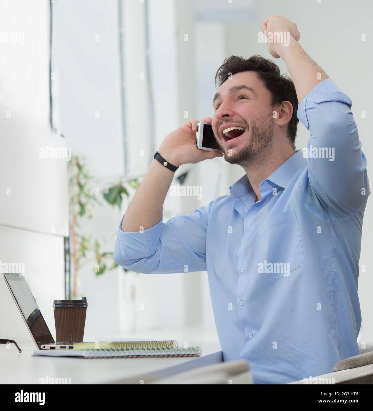 Freelancer speaking over phone Stock Photo - Alamy