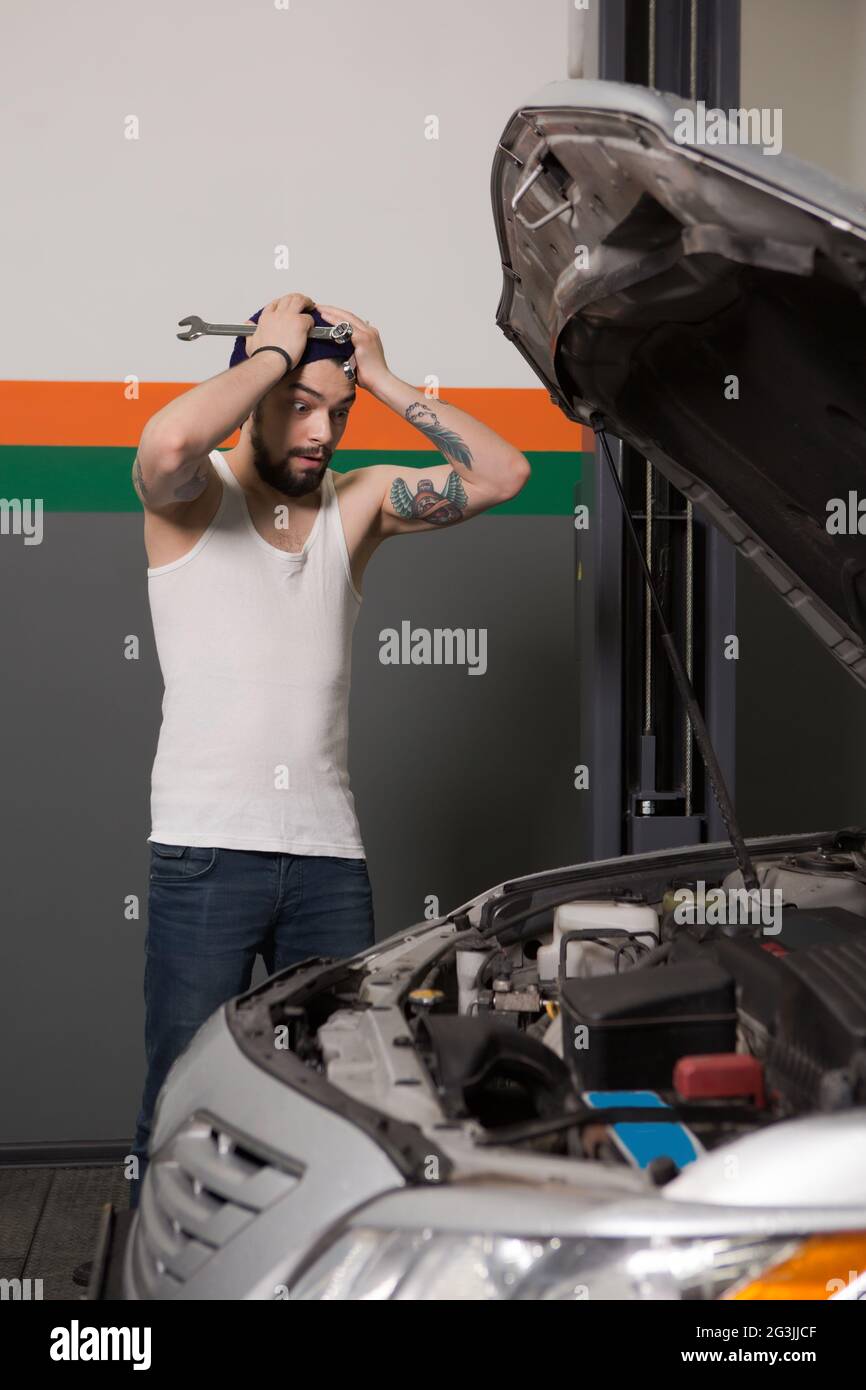 Worker at service station Stock Photo - Alamy