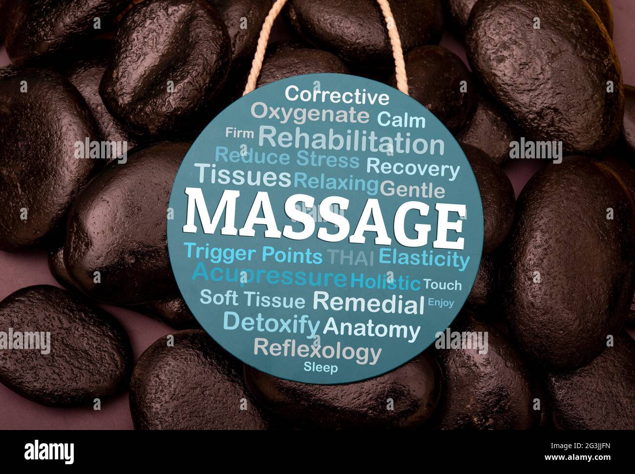 Massage words collage with black stones in background Stock Photo - Alamy