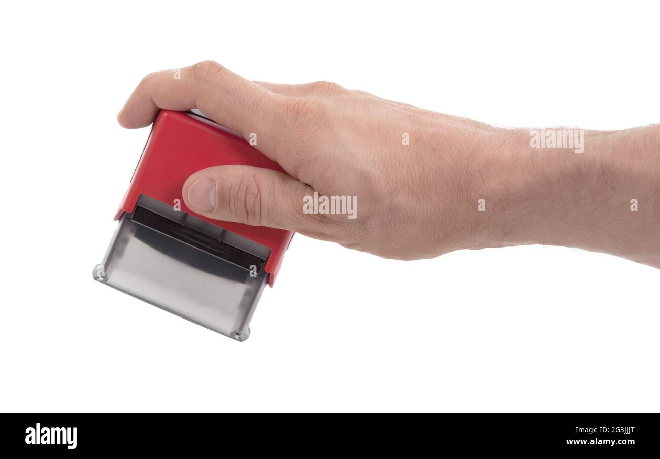 Plastic stamp in hand, isolated Stock Photo - Alamy