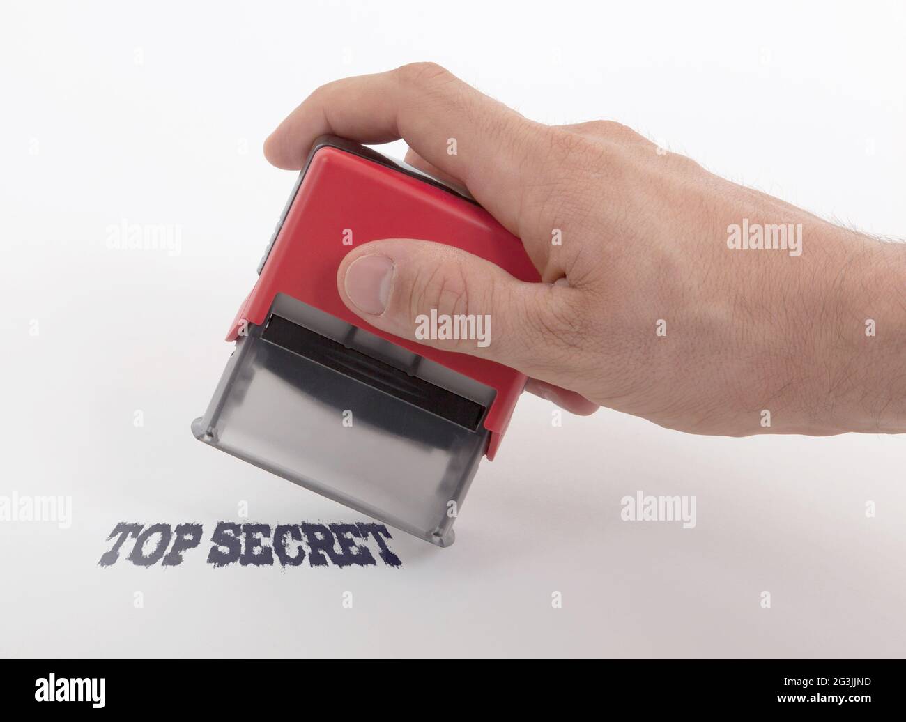 Plastic stamp in hand, isolated Stock Photo - Alamy