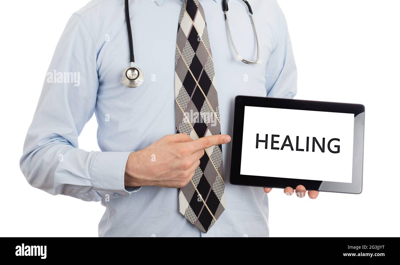 Doctor holding tablet - Healing Stock Photo - Alamy