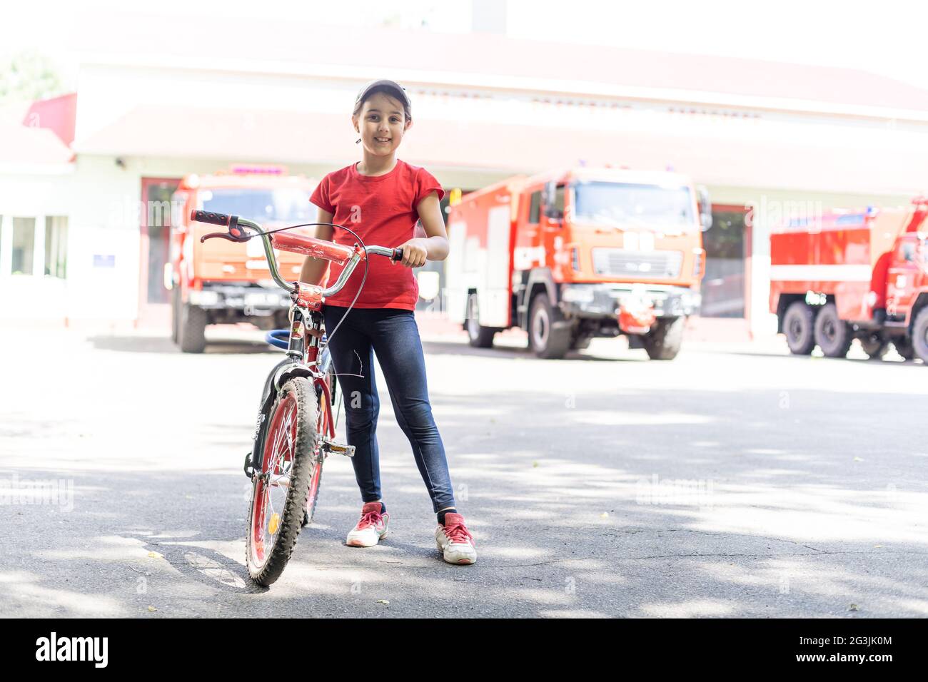 little kid near red fire truck Stock Photo - Alamy