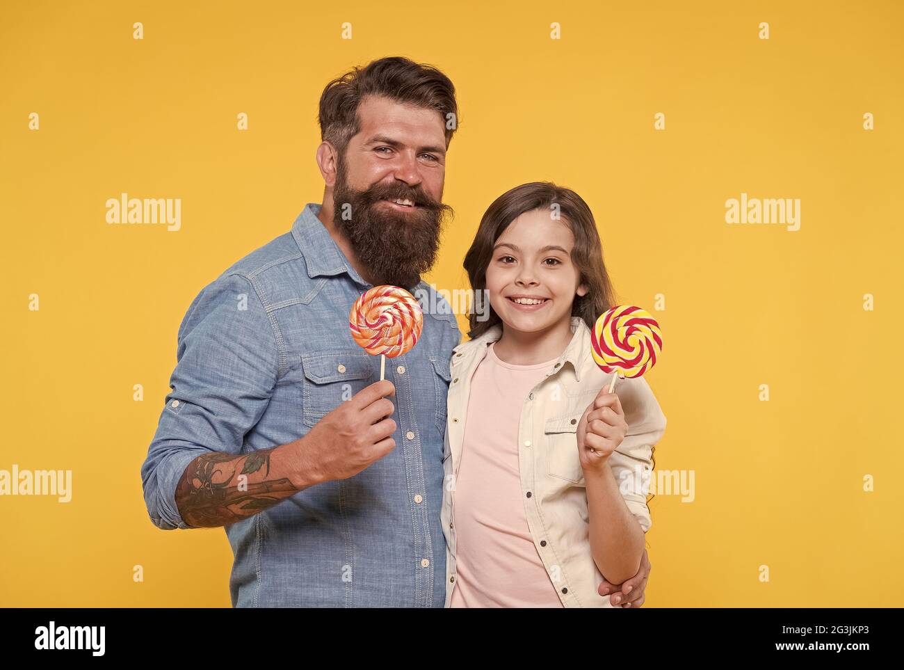 Dessert makes mouths happy. Happy family hold lollipops yellow ...