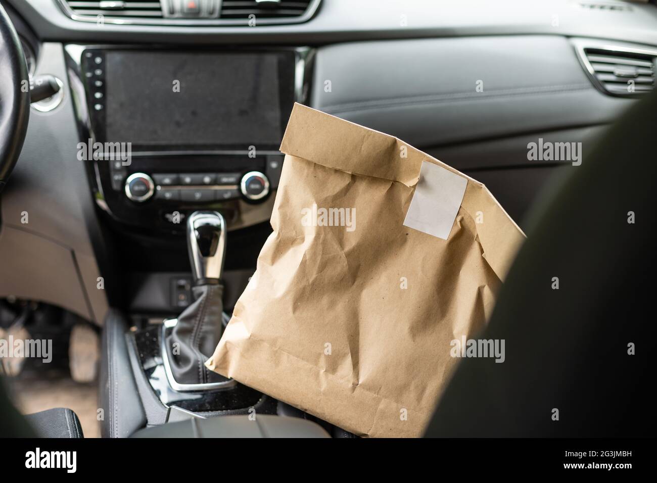 parcels in delivery car. driving with parcels Stock Photo - Alamy