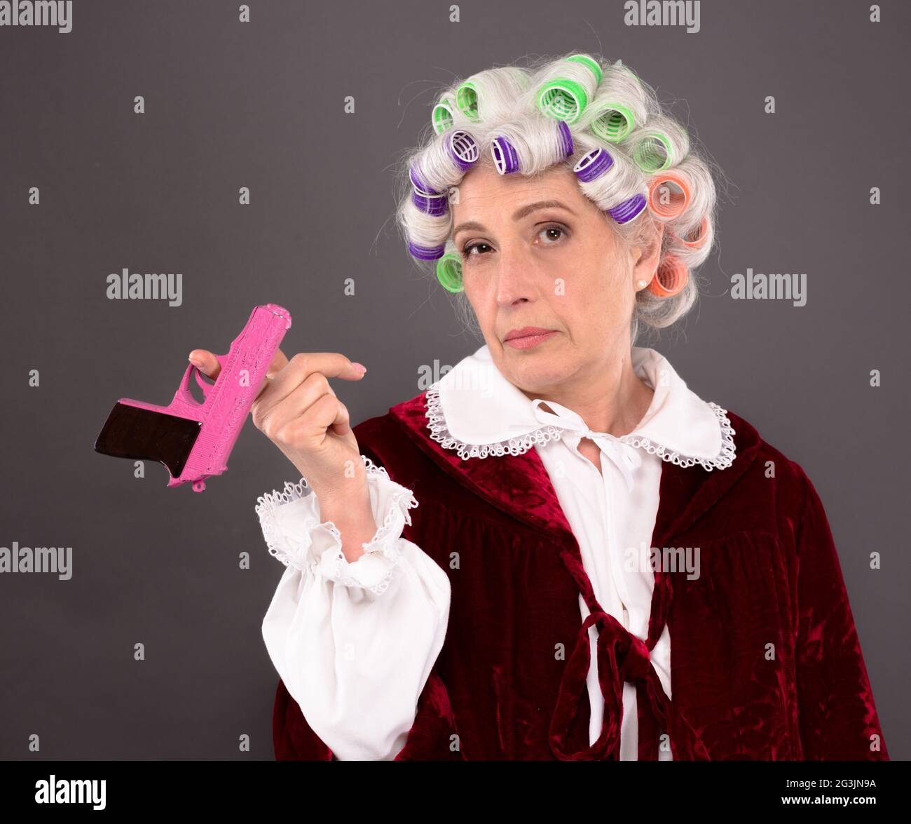 Grandmother with gun Stock Photo - Alamy
