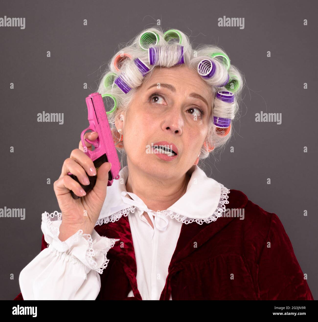 Grandmother with gun Stock Photo - Alamy