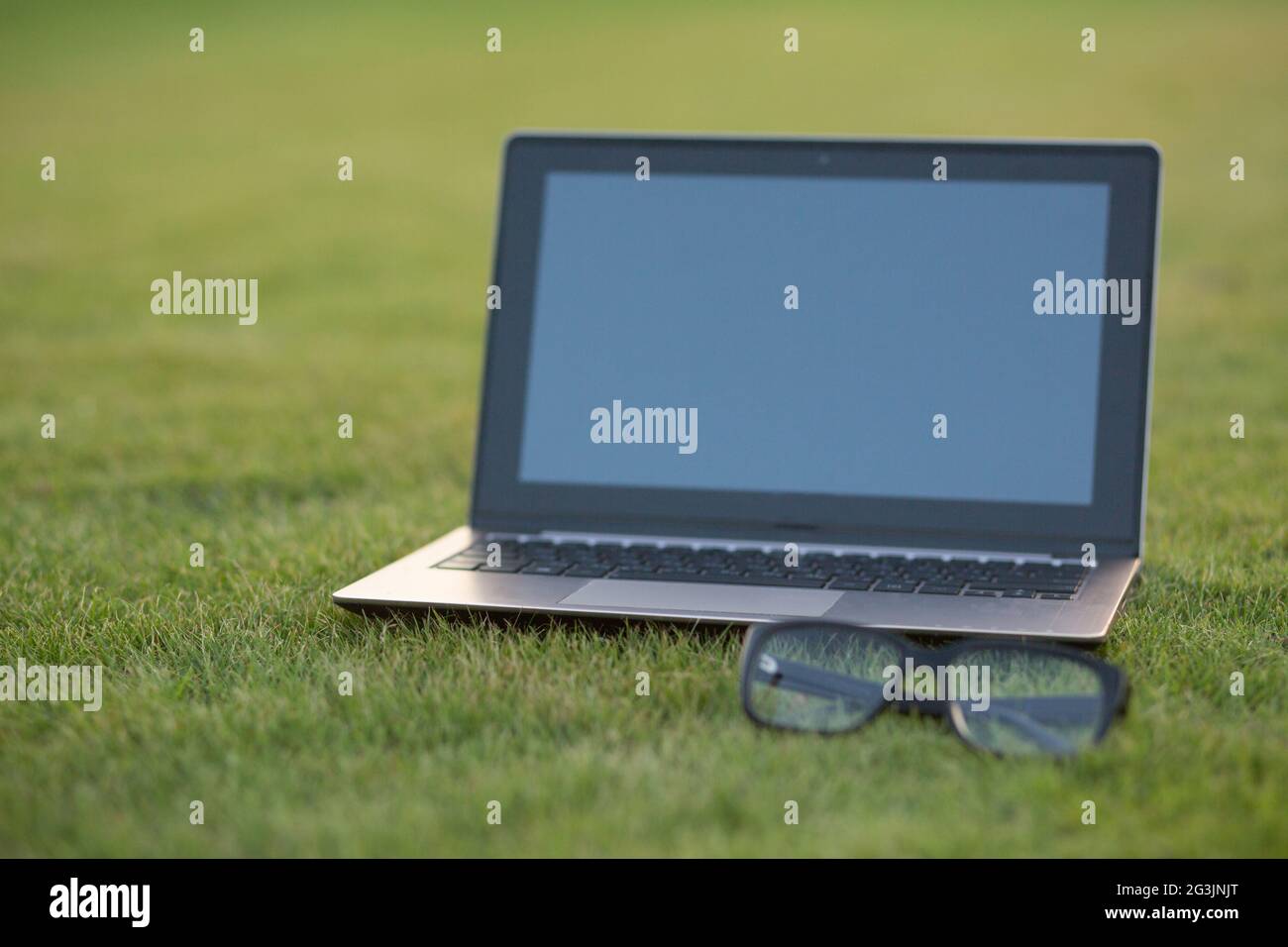 Laptop and glasses Stock Photo - Alamy