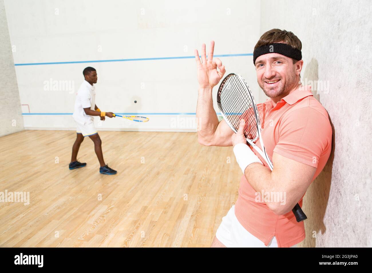 Men playing squash Stock Photo - Alamy