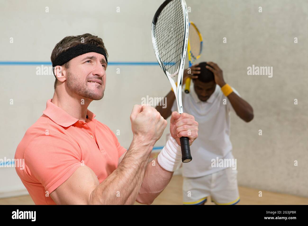 Men playing squash Stock Photo - Alamy