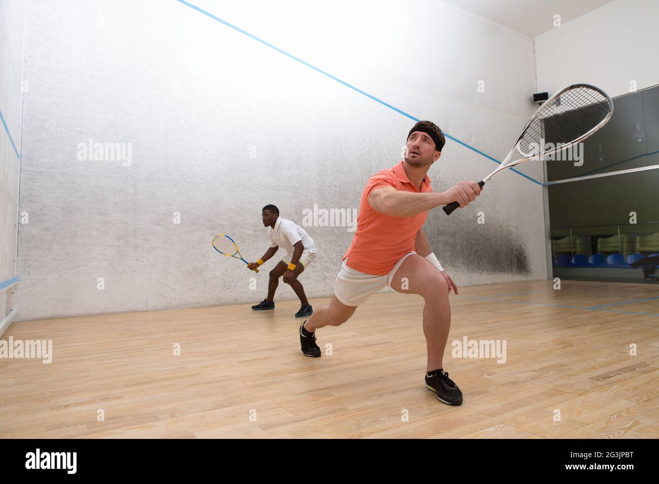 Men playing squash Stock Photo - Alamy