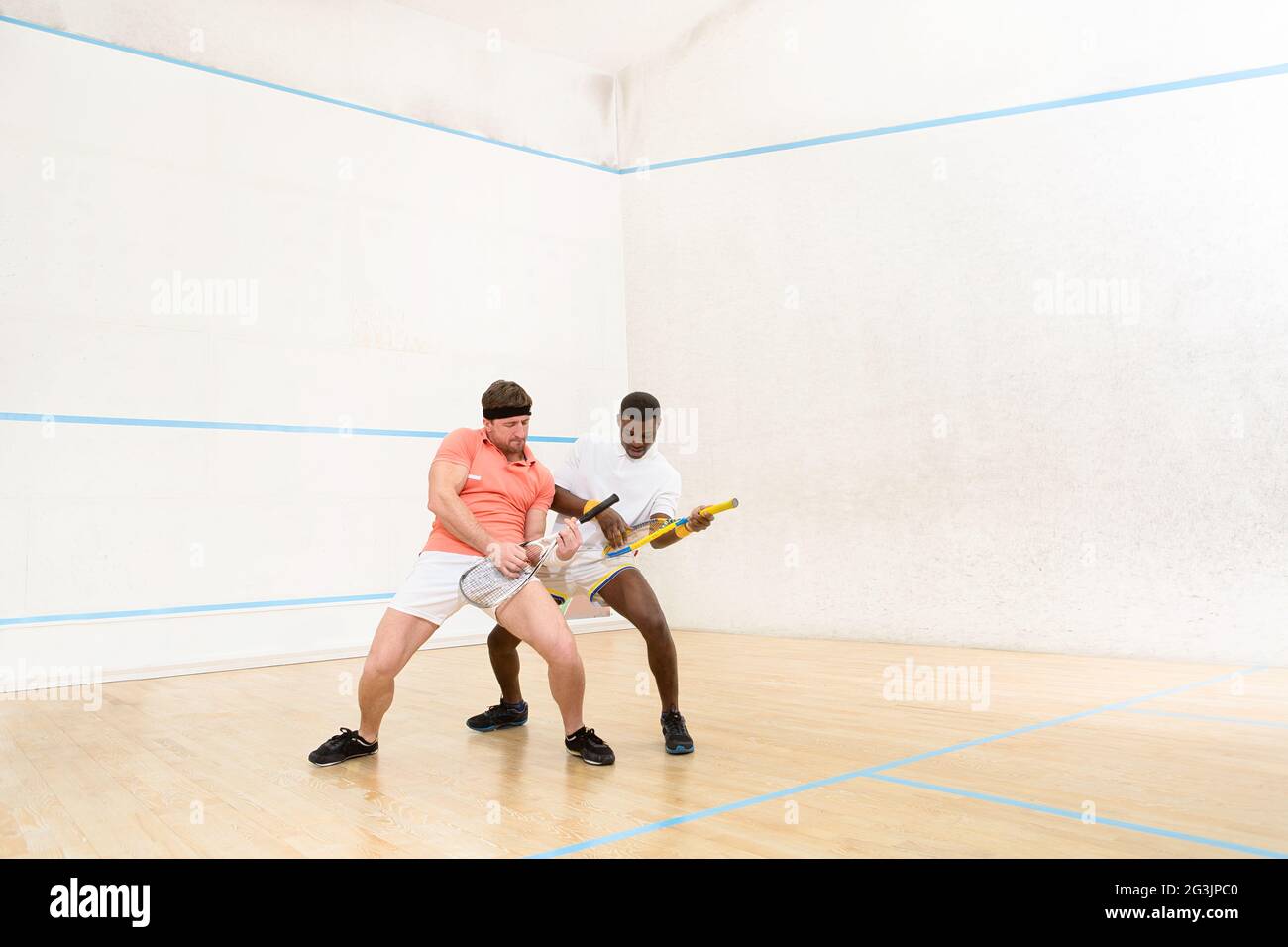 Men playing squash Stock Photo - Alamy